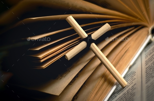 Homemade cross on an open Holy Bible book. Cross in open Bible. Stock ...