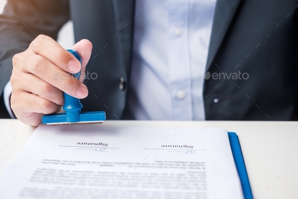 Businessman stamp during signing contract document.Business contract ...
