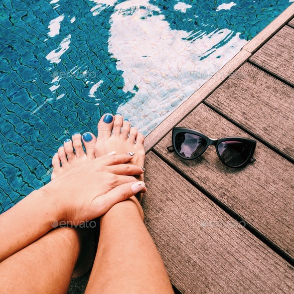 Chilling by the pool. Stock Photo by Hellobelleelle | PhotoDune