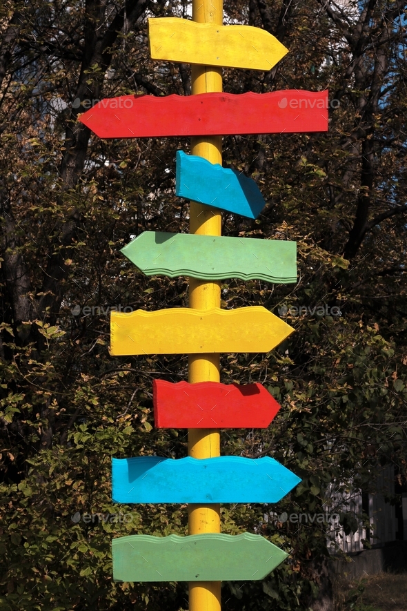 Colorful directional arrows on signpost Stock Photo by mirarahneva