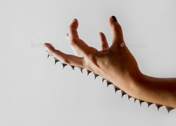 Spikes on human hand on white background Stock Photo by mirarahneva