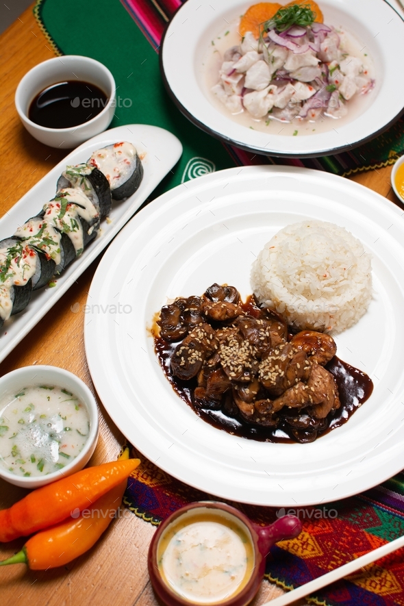 Peruvian cuisine. Table served with food. Roles, ceviche, tiraditos ...