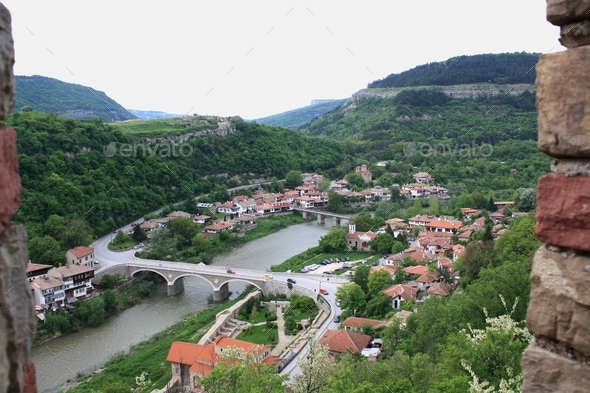 View from above of small town, bridge and river Stock Photo by mirarahneva