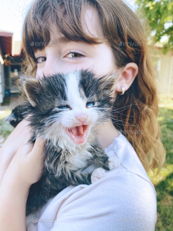 Kitten held by little girl meowing, cute, crazy hair, pet, love, funny ...