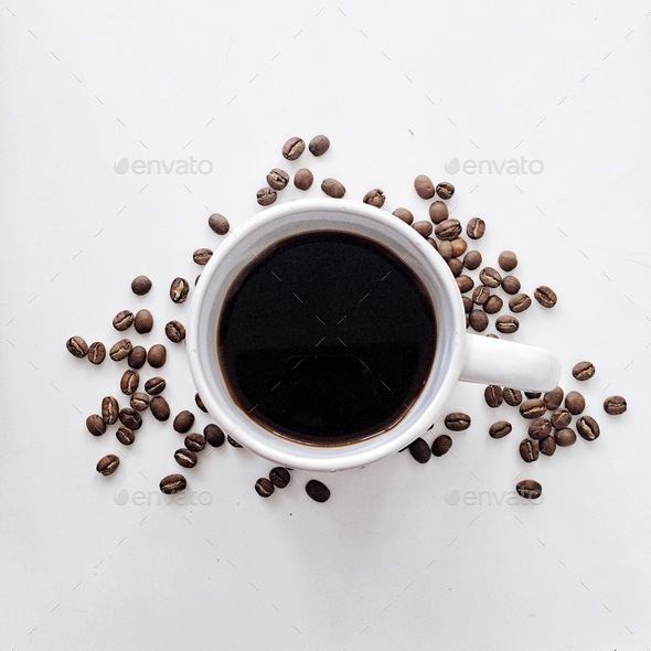 minimalistic shot of black coffee and coffee beans / minimalism ...
