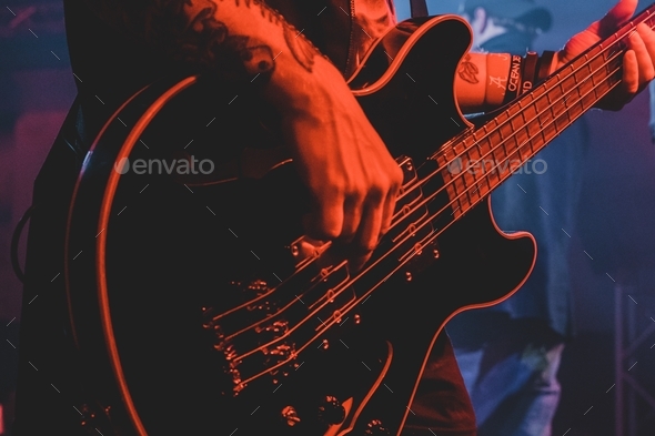 red and blue color / man playing guitar / bass / live concert ...