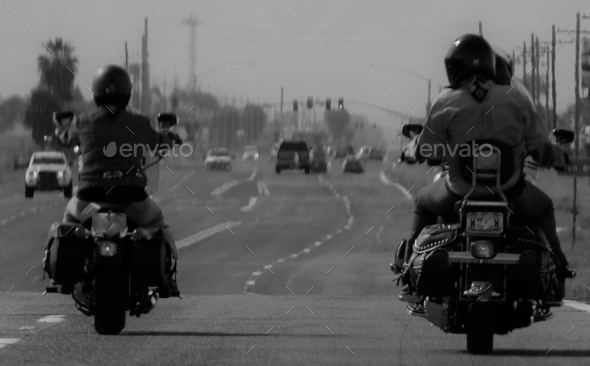 Out for a Ride! Two bikers, one with a passenger, are out for a ride ...