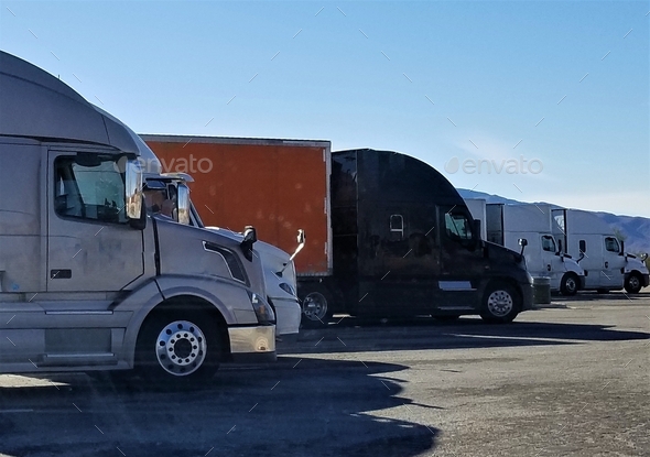 Transportation and Logistics! Several big rig sleeper cab trucks lined ...