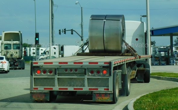 Transportation and Logistics! A large metal spool being hauled on a ...
