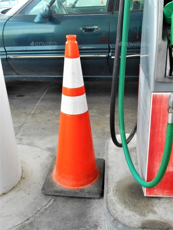 Orange Caution Cone at the Gas Pump! Stock Photo by AZ-BLT | PhotoDune