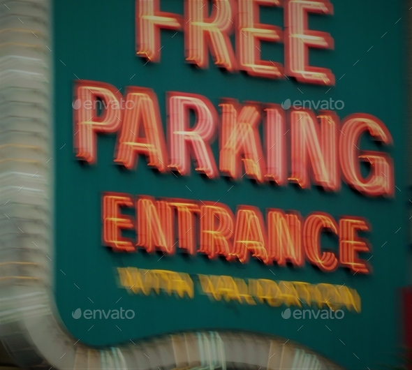 Neon Lighted Parking Sign in Daylight, at the Entrance to Public ...