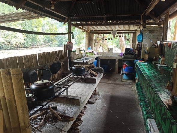 Traditional kitchen with firewood stove Stock Photo by myrageraldinej