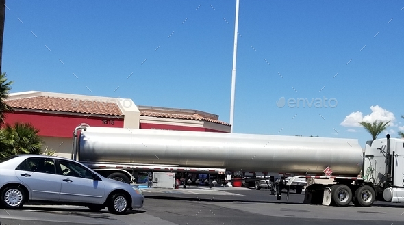 Gasoline Tanker Delivering to a Gas Station for refueling the empty ...