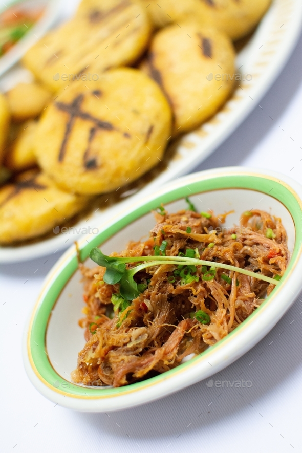 Arepa. Round bread made with pre-cooked cornmeal. Traditional dish from ...