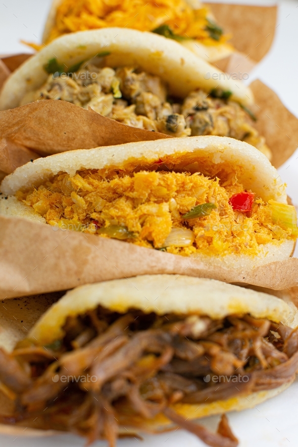 Arepas. Venezuelan food. Chicken. Fish. Meat. Scrambled eggs. Cornbread ...