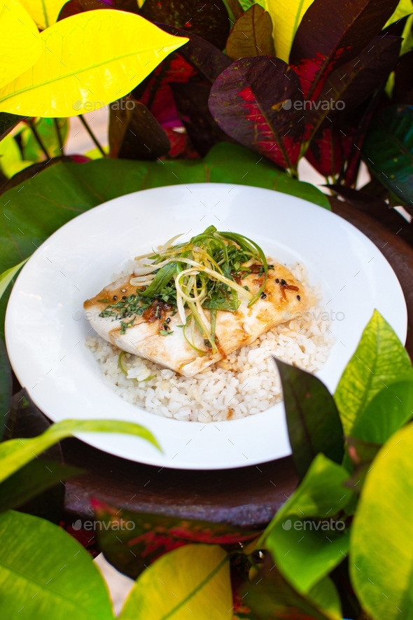 Steamed fish fillet, over white rice, with chives topping and honey and ...