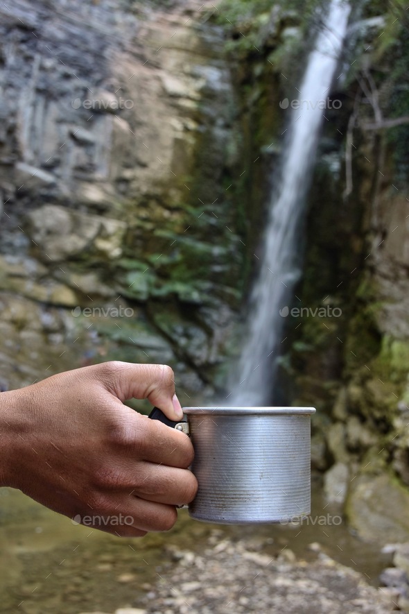 Drinking water from a waterfall Stock Photo by nodar77 | PhotoDune