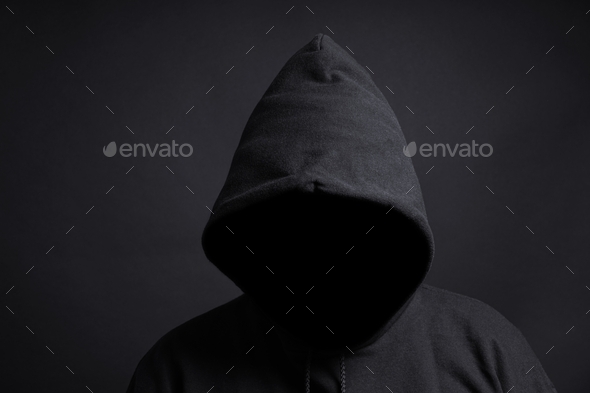 anonymous person with black hoodie and unrecognizable face hidden in ...