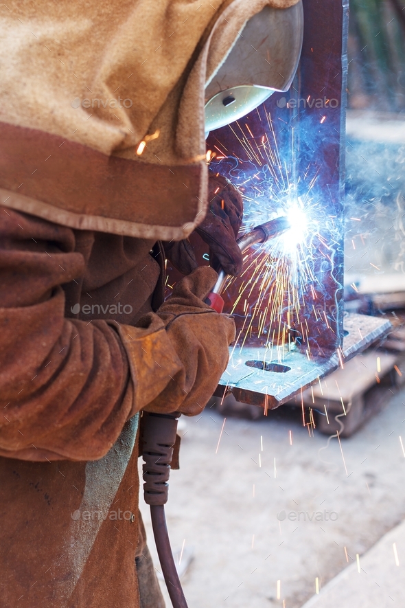 Welding work, welder welding metal material in heavy industry ...