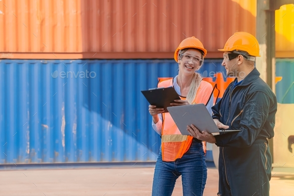 Workers male and female doing work with logistic cargo container import ...