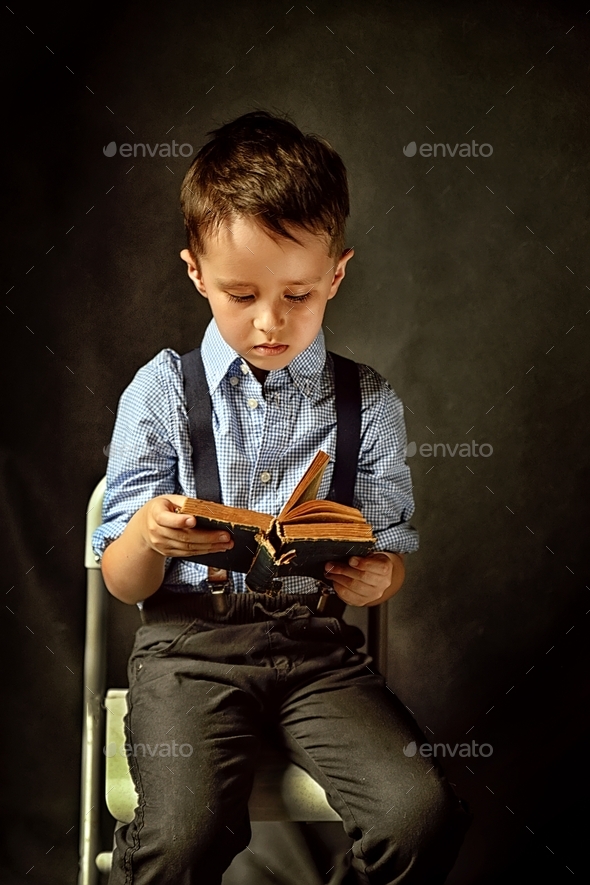 Boy reading a book Stock Photo by KSENIA7777 | PhotoDune