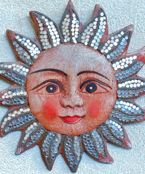 Artistically rendered sun face wall art Stock Photo by spencerpa440