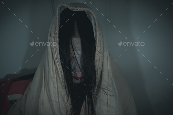 Horror scene of a mysterious girl in white face and scary Stock Photo ...