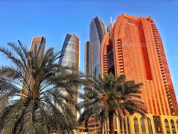 Modern high rise architecture with tropical palm trees Stock Photo by ...