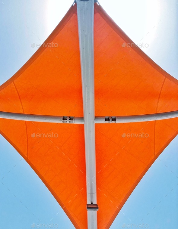 Kite like awning is a shade maker in The Desert City By The Sea Stock ...