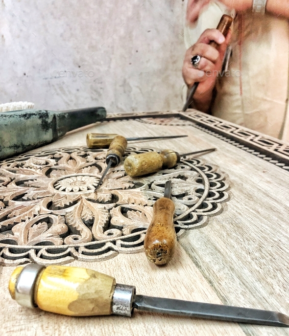 Artisan woodworker building a custom built wooden cabinet by hand with ...