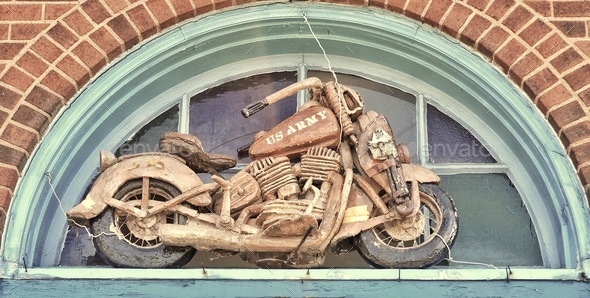 Motorcycle Art in a Brick Window Frame Stock Photo by spencerpa440