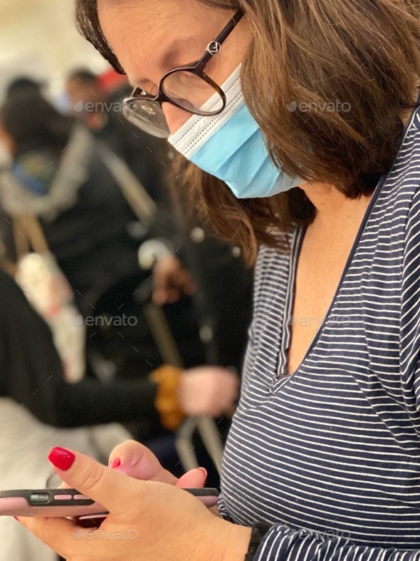 Middle aged baby boomer woman messaging family on smartphone while ...