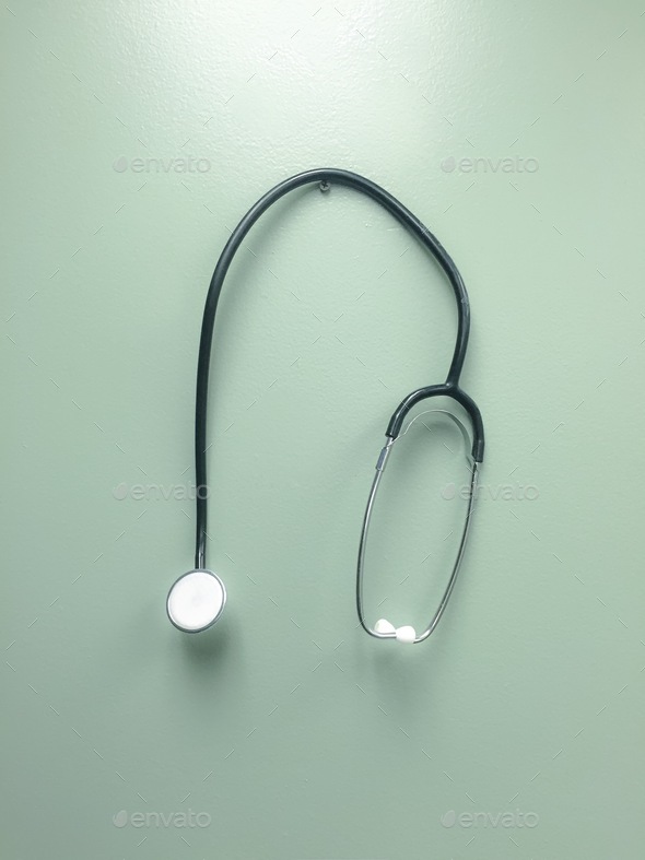 Doctors stethoscope hanging on the wall of a doctors office or nurses ...
