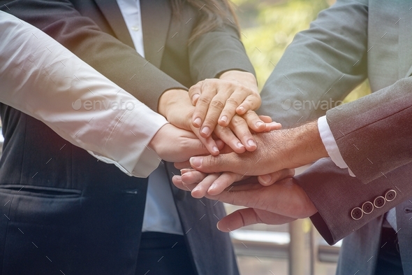 Hand of teamwork with lots of hands on top of each others as power of ...