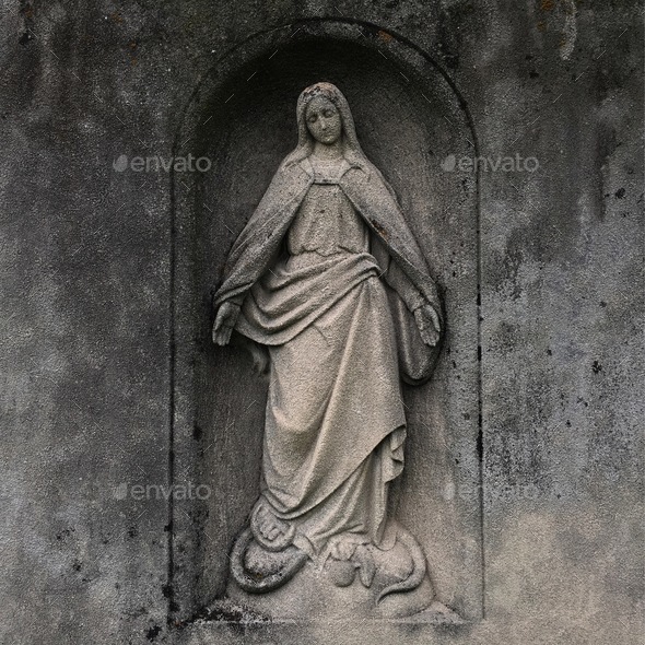 Statue of Virgin Mary standing on a snake Stock Photo by wolfewithane