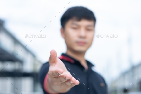 Close up giving a helping hand, man asking or offering help.(hand focus ...