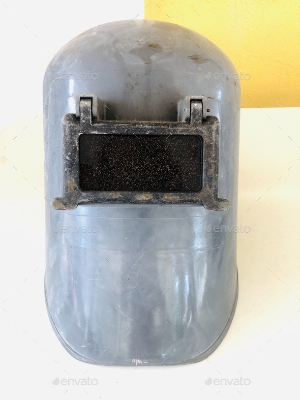 A welder’s helmet to protect him from any sparks. Stock Photo by marisap7