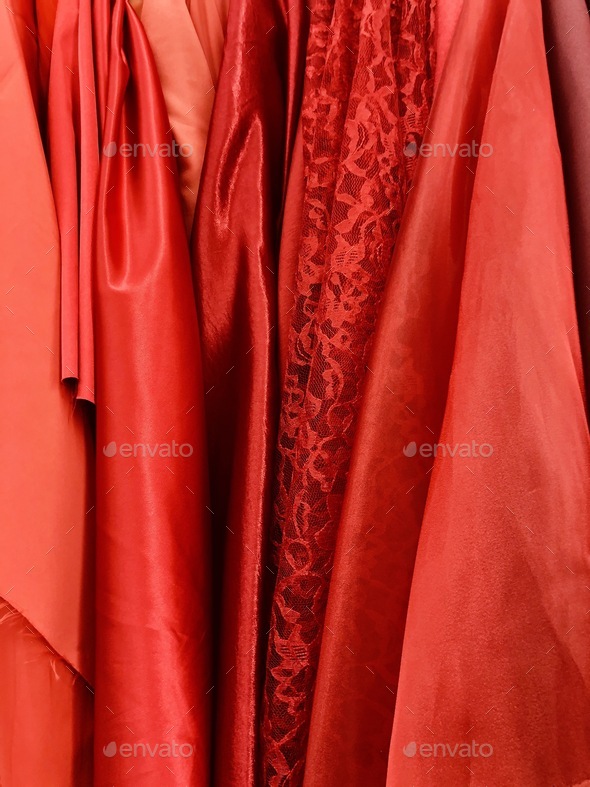 Satin lace fabrics in different shades of red. Stock Photo by marisap7