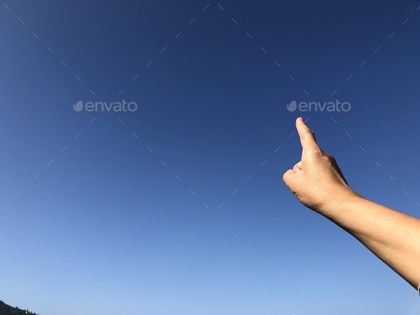 Finger is pointing blue sky background Stock Photo by Thanineech ...
