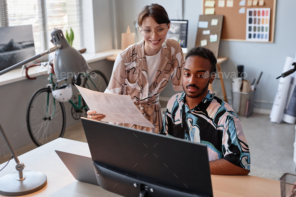 Creative team working on design project Stock Photo by seventyfourimages