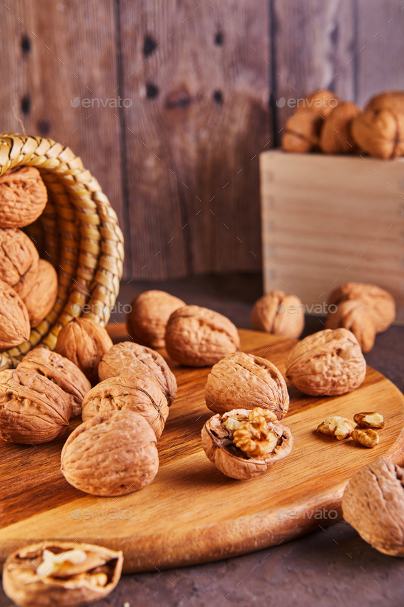 Walnuts in a wooden box, whole and finely chopped, next to the filling ...