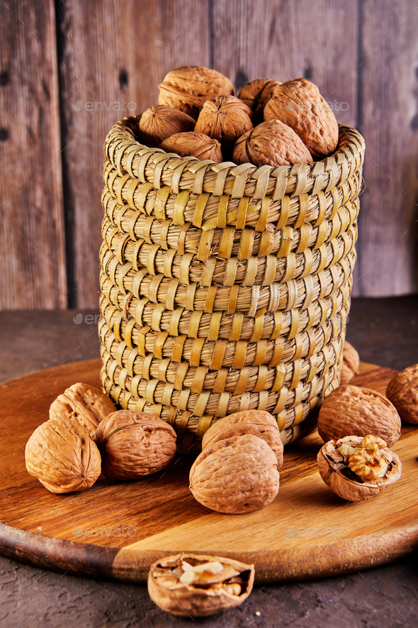 Walnuts in a wooden box, whole and finely chopped, next to the filling ...