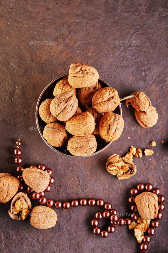 Walnuts in a wooden box, whole and finely chopped, next to the filling ...