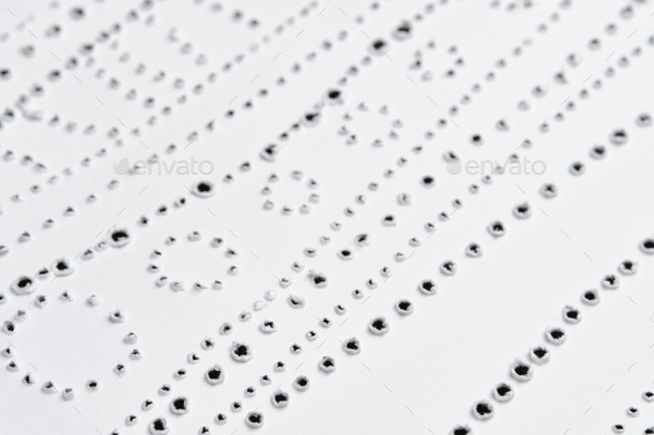 Perforated pattern on surface of paper. Close-up texture Stock Photo by ...