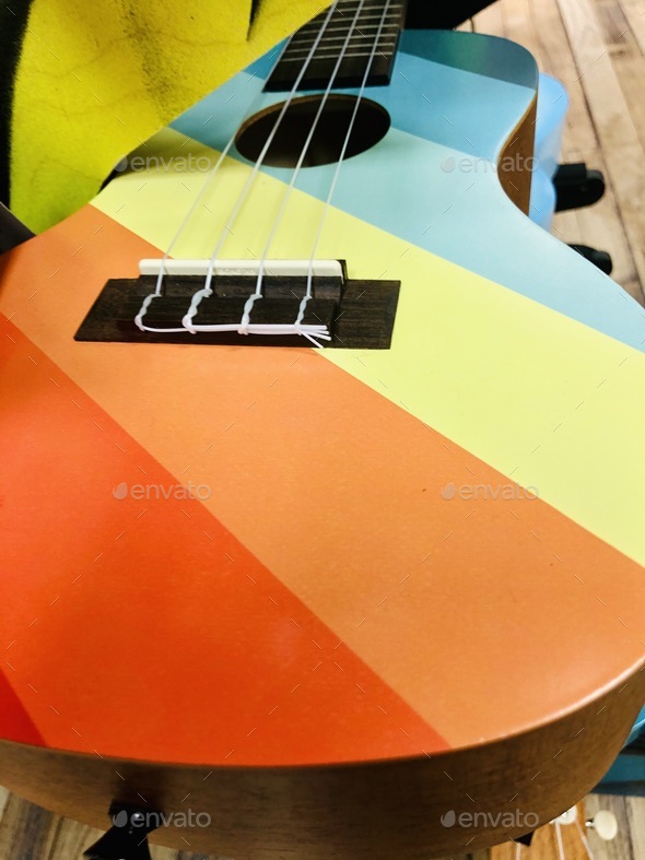 Colorful minimalism, , a rainbow colored ukulele. Stock Photo by marisap7