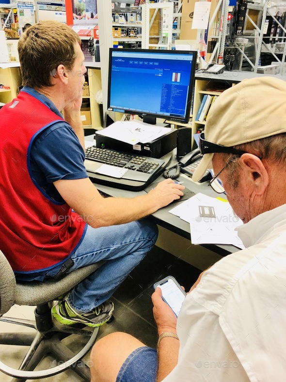 Business professional helping a customer with a purchase. Stock Photo ...