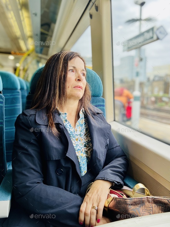 Senior woman staring out of the window. Stock Photo by marisap7 | PhotoDune