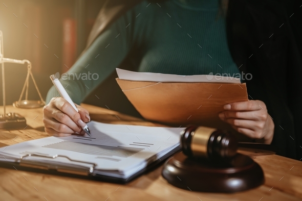 Lawyer working with paperwork on his desk in office workplace for ...