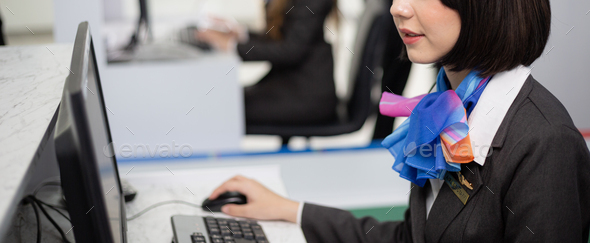 Female officer working at airline check in counter service Stock Photo ...