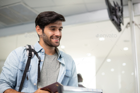 Caucasian tourist man check-in at airline counter service Stock Photo ...